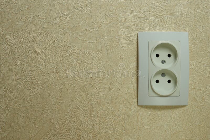 Double White Plastic Electrical Socket on the Wall Stock Photo - Image ...