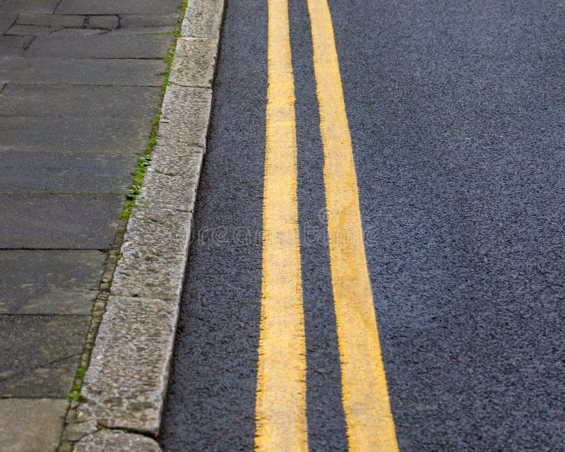 Double Yellow Lines stock image. Image of double, yellow - 319019395