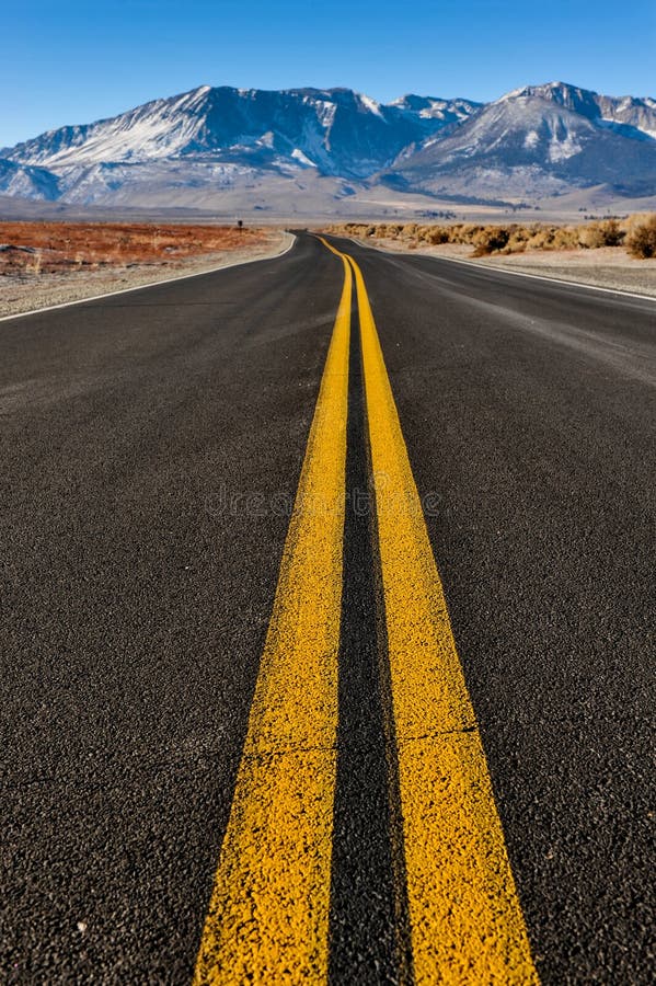 Double Yellow Lines in Middle of Road Stock Image - Image of line, blue ...