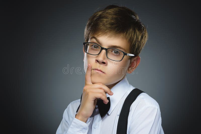 Doubt, Expression and People Concept - Boy Thinking Over Gray ...