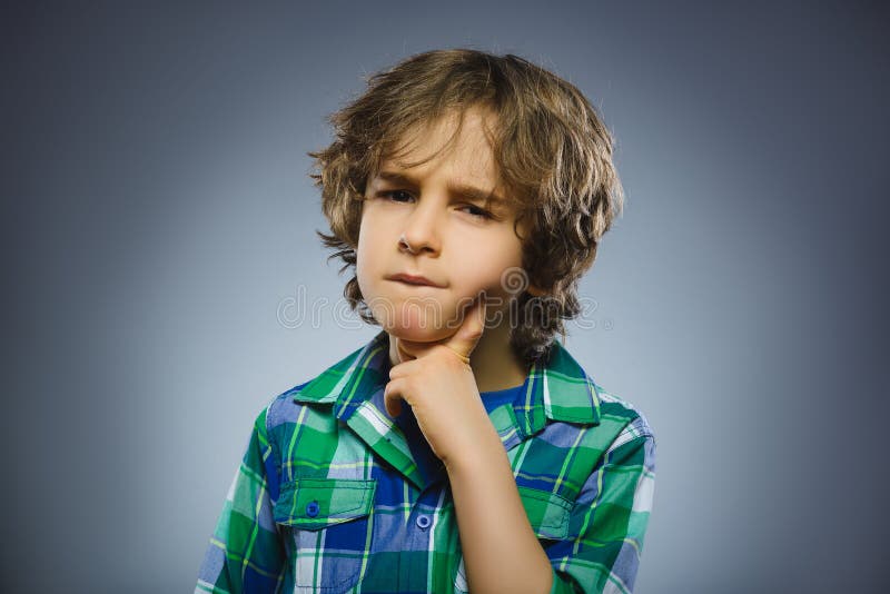 Doubt, Expression and People Concept - Boy Thinking Over Gray ...
