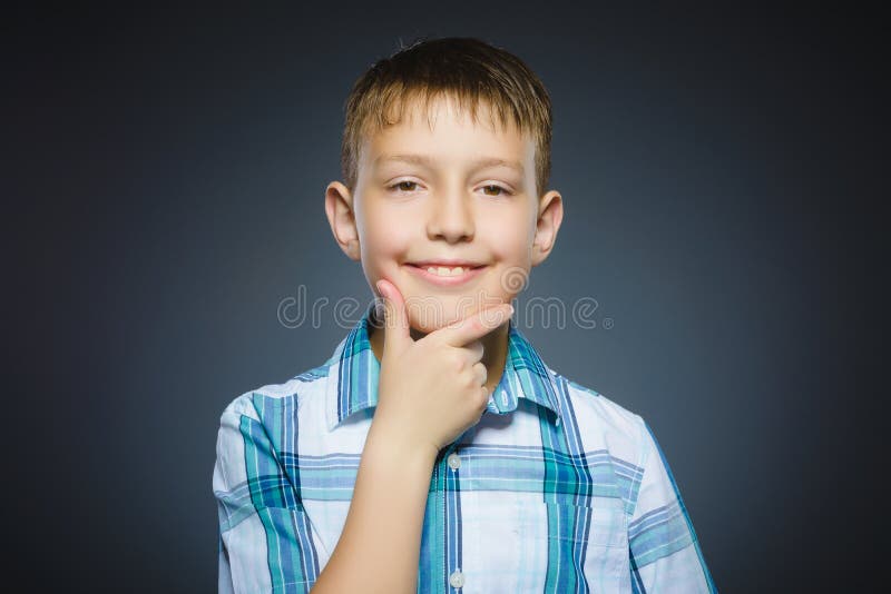 Doubt, Expression and People Concept - Boy Thinking Over Gray ...