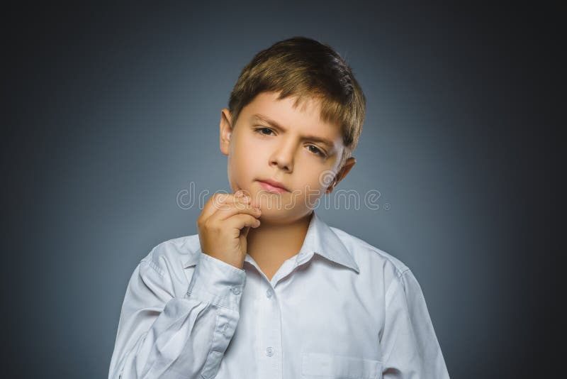 Doubt, Expression and People Concept - Boy Thinking Over Gray ...