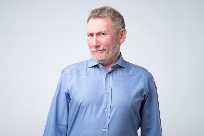 Senior Man in Blue Shirt Looking with Disbelief Expression . Stock ...