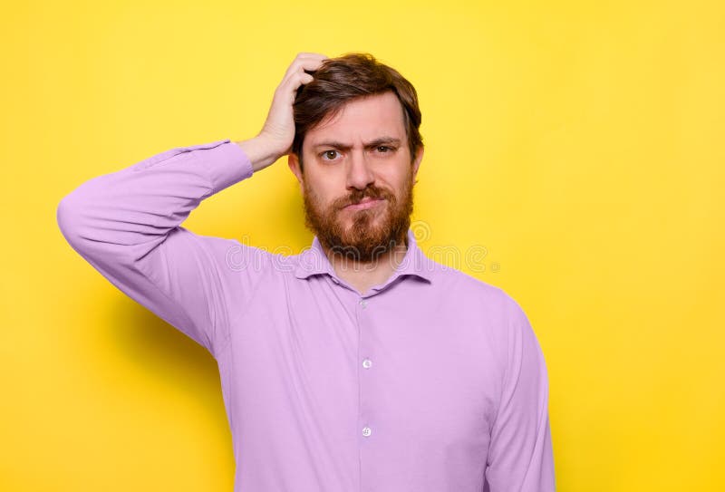 Doubtful Bearded Man Face Expression on Yellow Background Stock Photo ...
