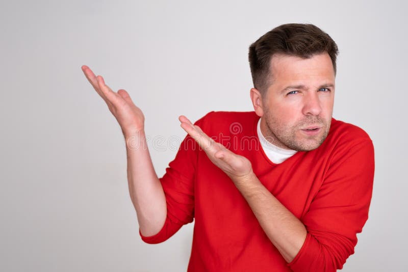 Doubtful Man Points at Corner, Feels Hesitant about Something Stock ...