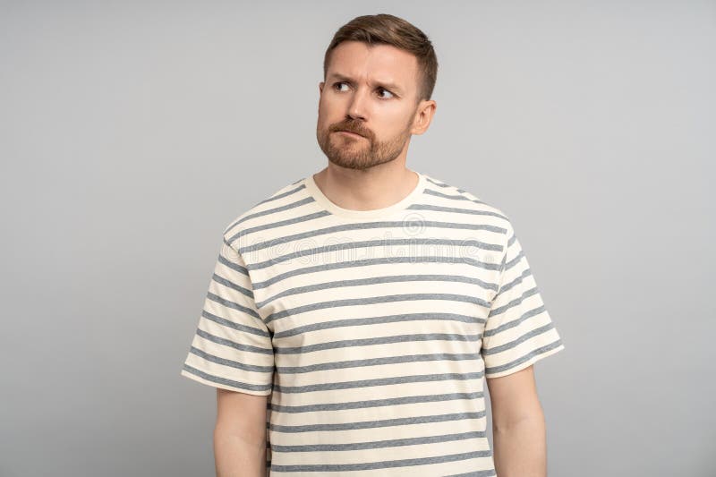 Thoughtful Middle Aged Man with Doubtful Puzzled Face Expression in ...