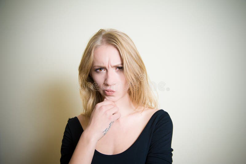 Doubtful Young Blonde Woman Portrait Stock Image - Image of doubtful ...