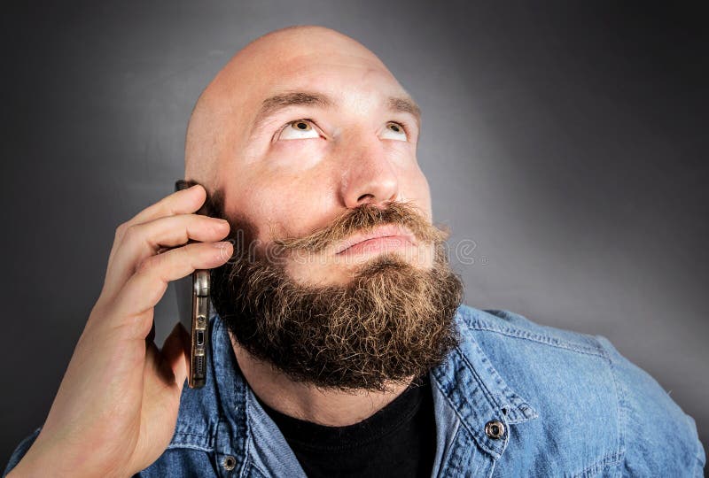 Doubting Man Speaking on the Phone Stock Image - Image of bored ...