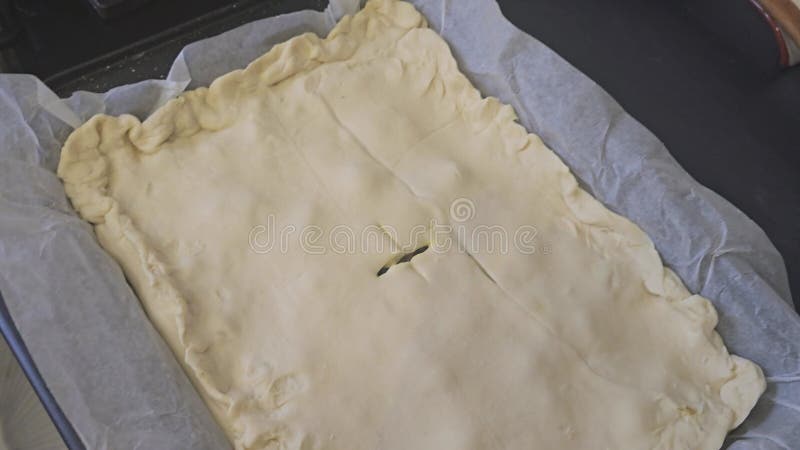 Dough on a Baking Sheet with Filling. Step-by-step Preparation of the ...