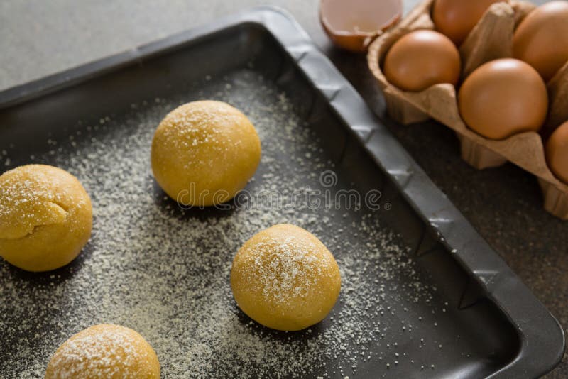 Dough Balls with Icing Sugar on Baking Tray Stock Photo - Image of ...