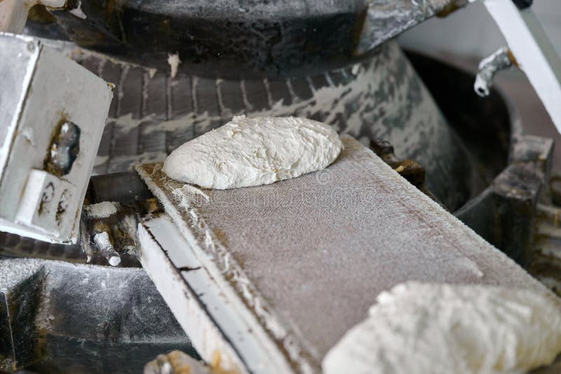 Dough Being Transported on Conveyor Belt in a Baking Facility during ...