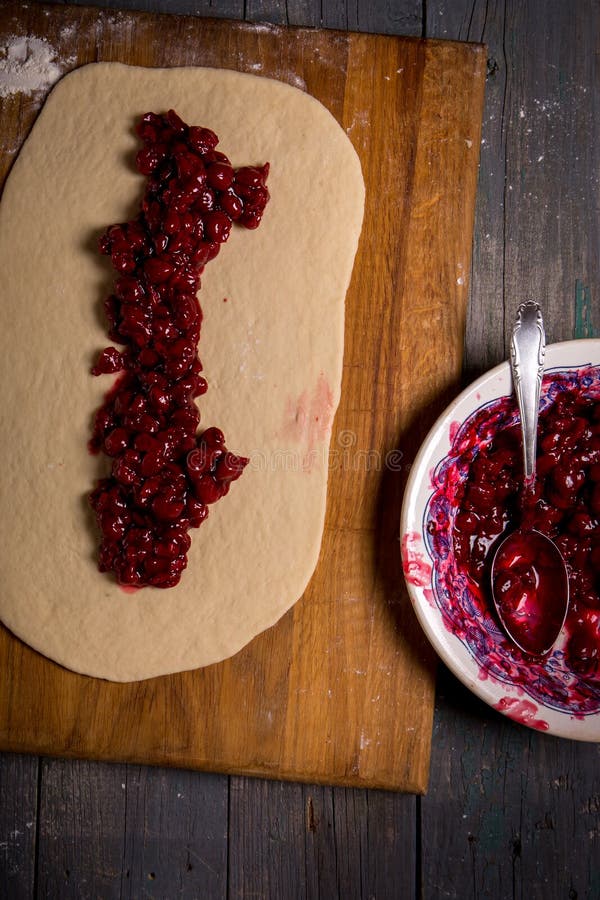 Dough with cherry filling stock image. Image of filling - 127089263