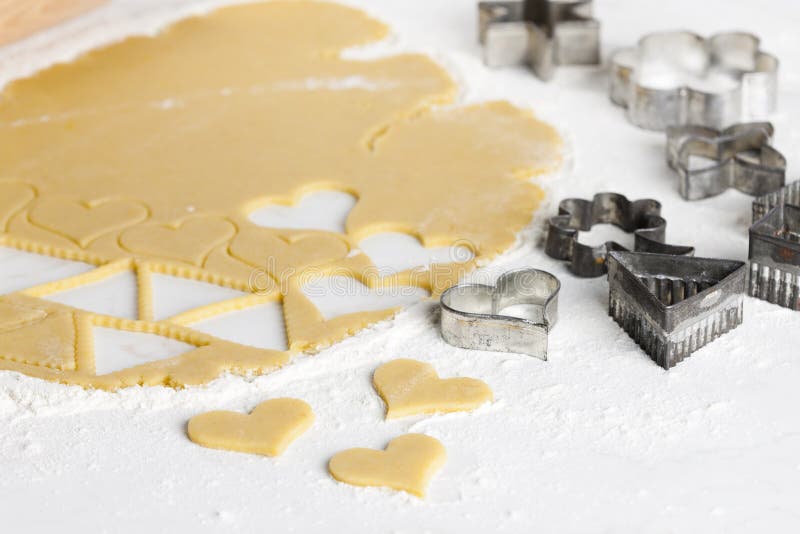 Dough with cookie cutters stock image. Image of cookie - 27010431