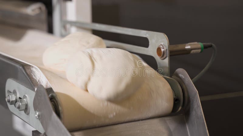 The Dough Moves Along the Conveyor. Bread Production Process. Bakery ...