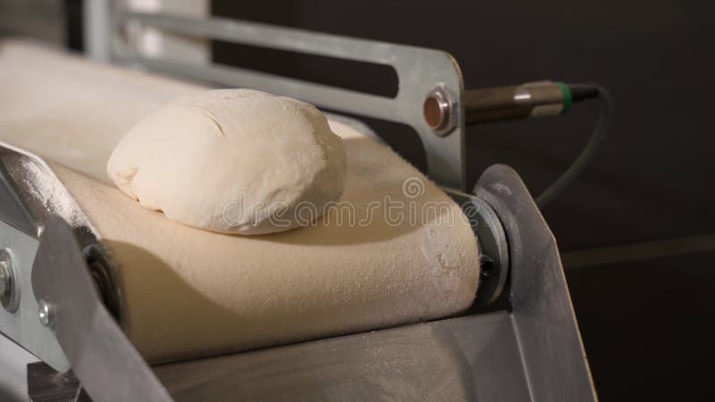 The Dough Moves Along the Conveyor. Bread Production Process. Bakery ...