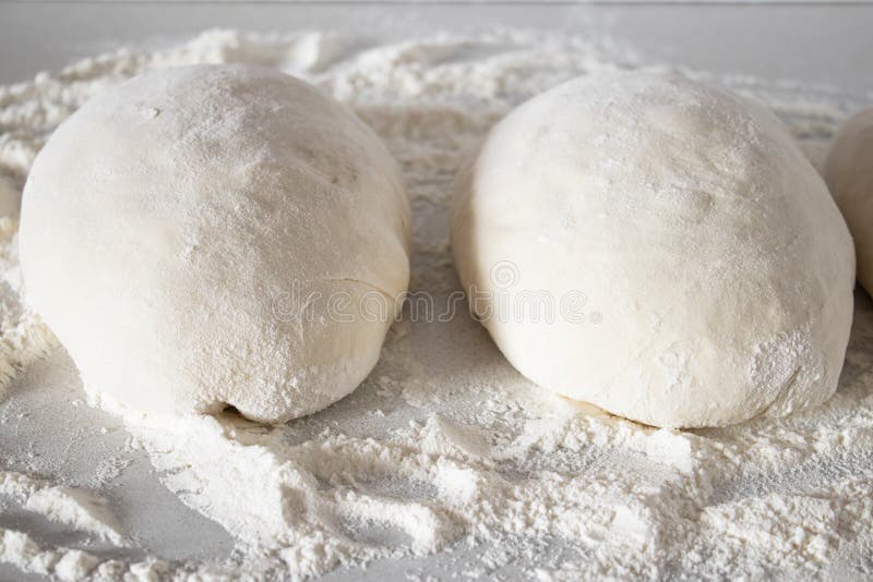 Pieces of Dough on a White Table with Flour Stock Photo - Image of ...