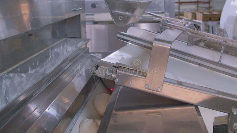 Dough Pieces on the Working Conveyor Line of Dough Machine in a Bakery ...