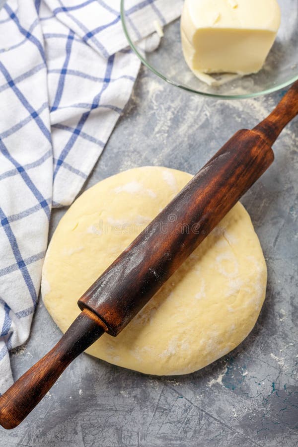Dough is Rolled Out with Rolling Pin for the Dough Stock Image - Image ...