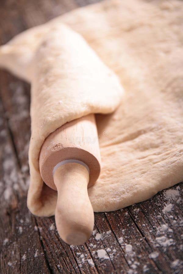Raw dough and rolling pin stock photo. Image of homemade - 67797778