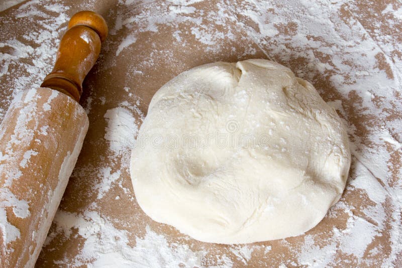 Dough on table stock image. Image of hand, flour, baker - 71083789