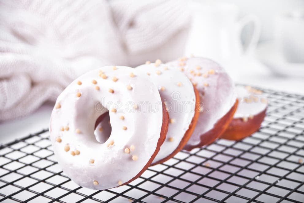 Doughnut on the Baking Rack Glazed with White Chocolate Cream or Icing ...