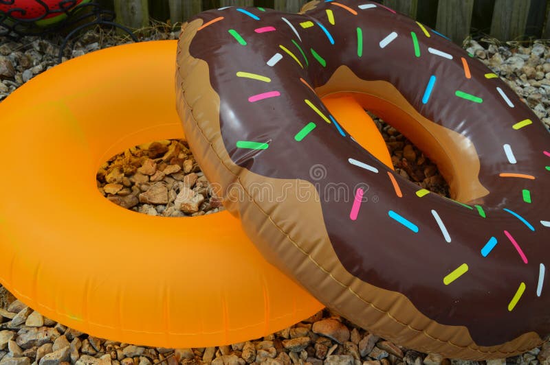 Doughnut Shaped Pool Floats Stock Image - Image of ring, donuts: 122946253