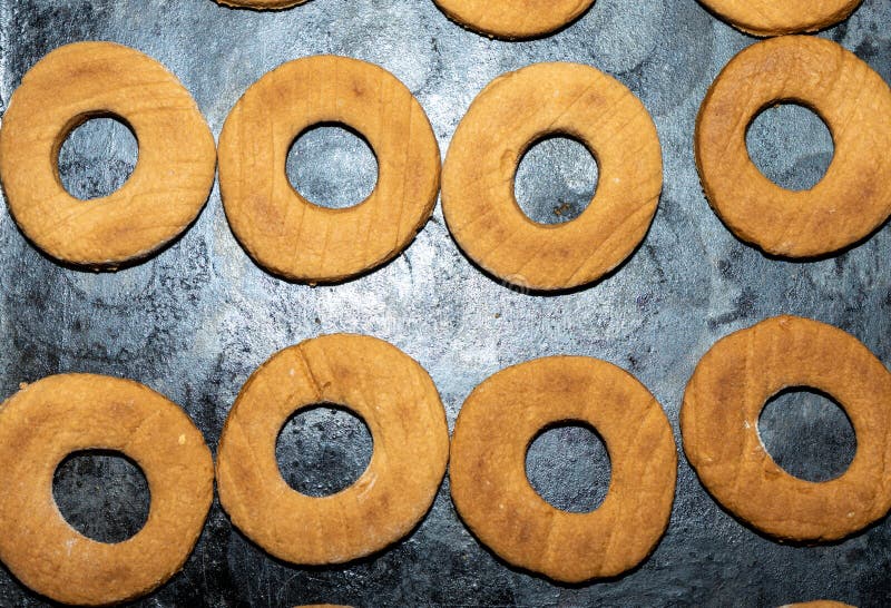 Freshly Made Doughnuts on a Baking Tray Ready for Frying Stock Photo ...