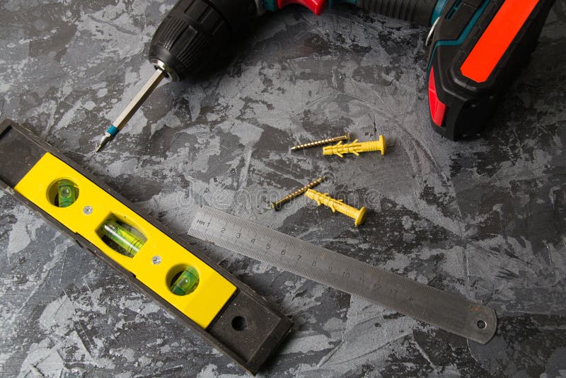 Dowel Screwdriver and Level on Concrete. Concept Advertising ...