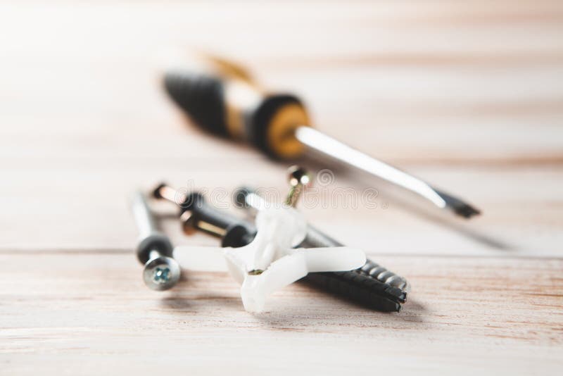Dowels and Screwdriver on the Table Stock Photo - Image of renovation ...