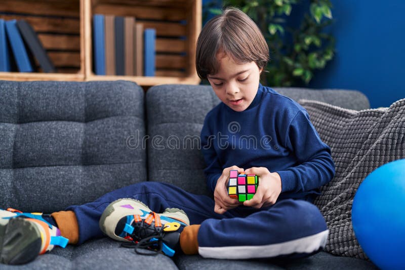 Down Syndrome Kid Playing with Puzzle Cube at Home Editorial Image ...