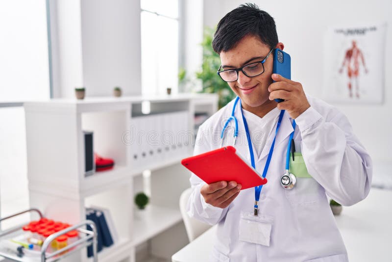 Down Syndrome Man Wearing Doctor Uniform Using Touchpad and Talking on ...