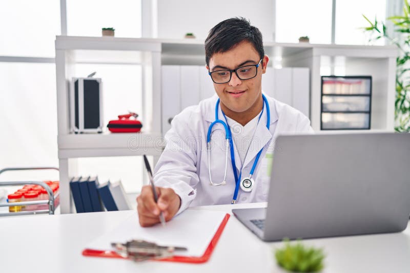 Down Syndrome Man Wearing Doctor Uniform Writing on Document Working at ...