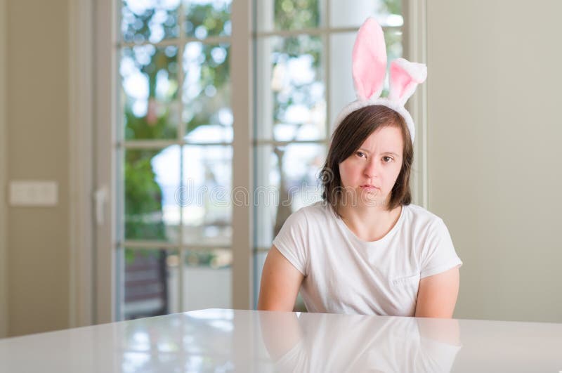 Down Syndrome Woman at Home Wearing Easter Rabbit Ears with a Confident ...