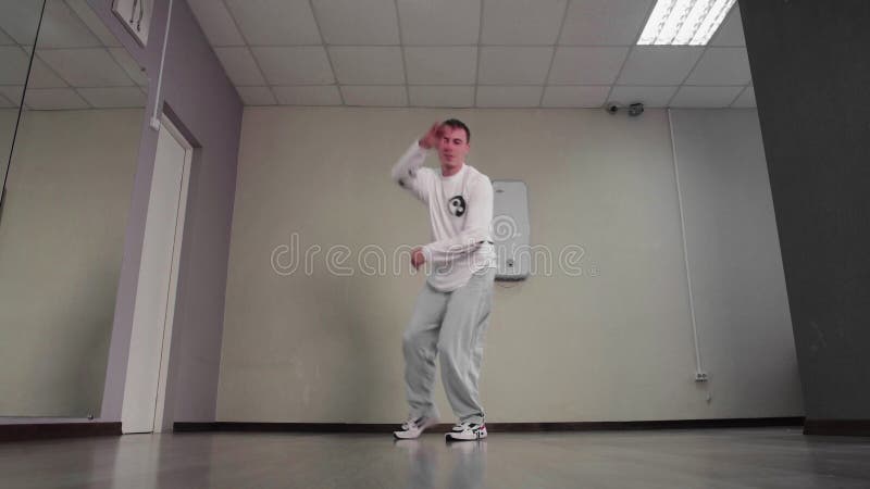 Down View of Young Guy Breakdancer Dances Hip Hop on Floor in Studio ...