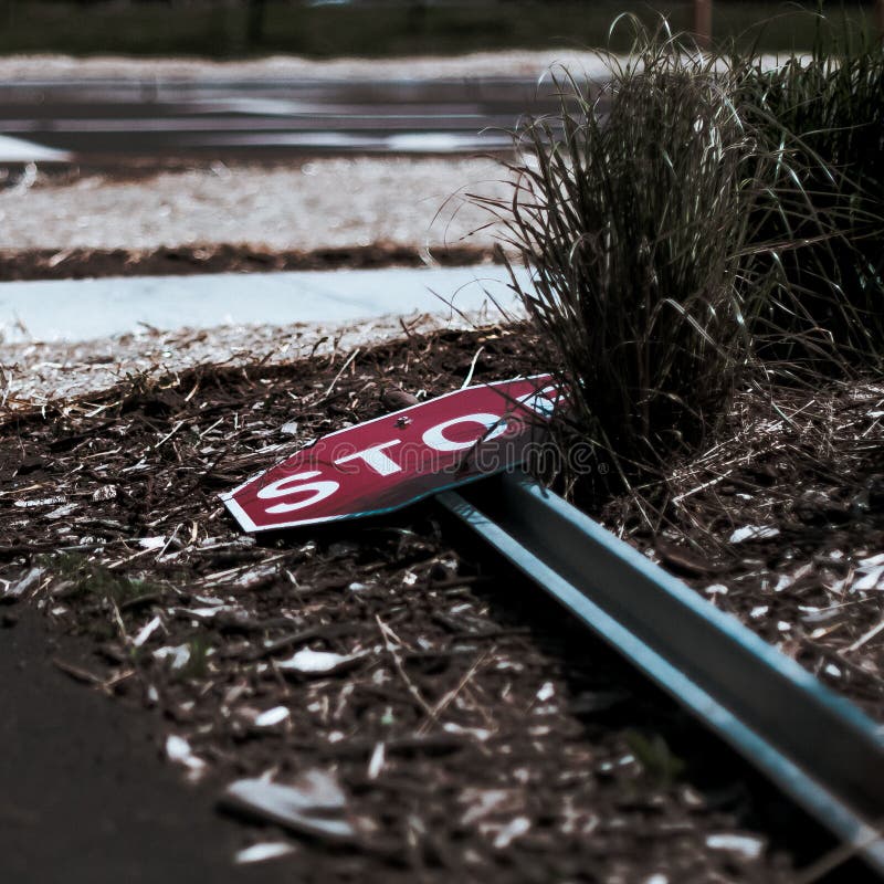 A Fallen Stop Sign on the Ground Stock Image - Image of symbol, traffic ...