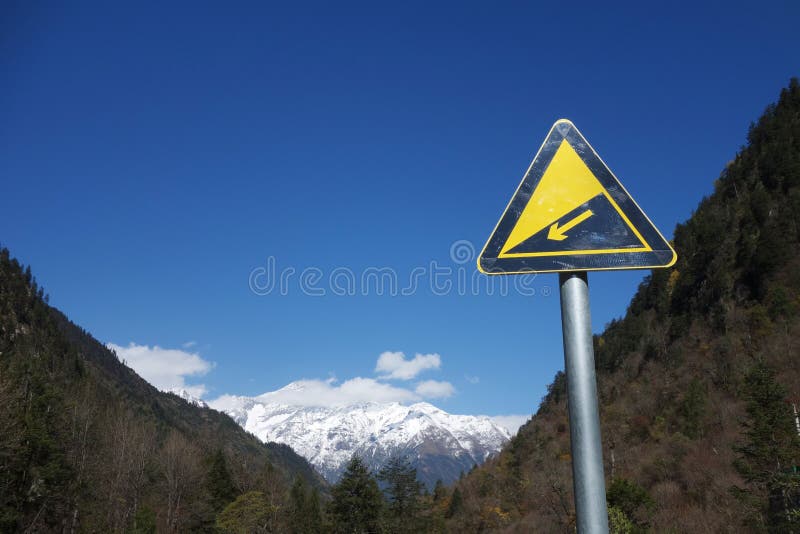 Downhill Road Sign with Snow Mountains Stock Photo - Image of board ...