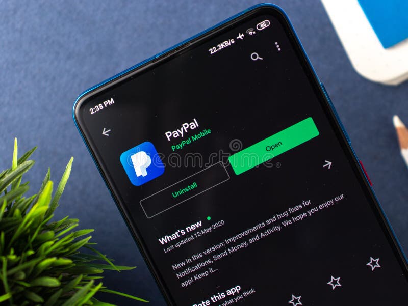 Downloading Paypal Mobile App from Google Play Store Photographed on ... Downloading Paypal Mobile App from Google Play Store Photographed on ...