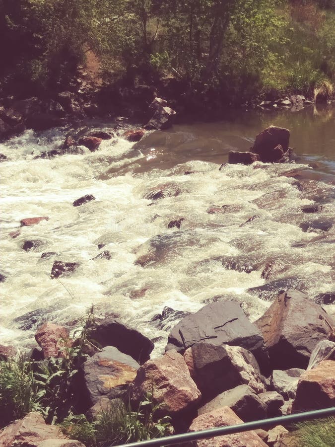A Downtown River Hiding Under a Bridge Stock Photo - Image of beautiful ...