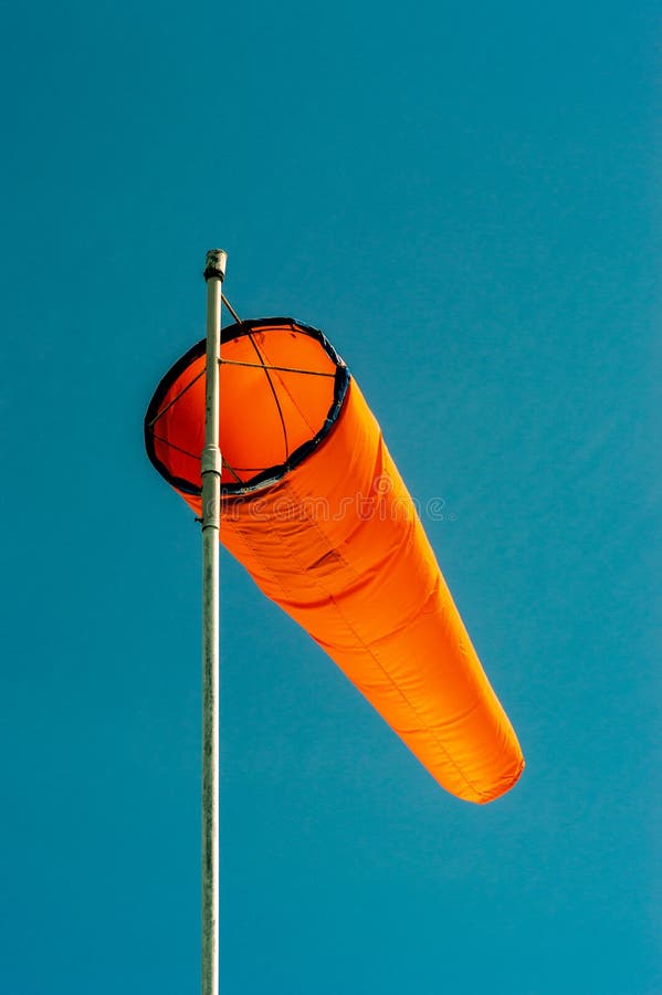 Downward Angled Plain Orange Windsock Against a Clear Blue Sky. Stock ...