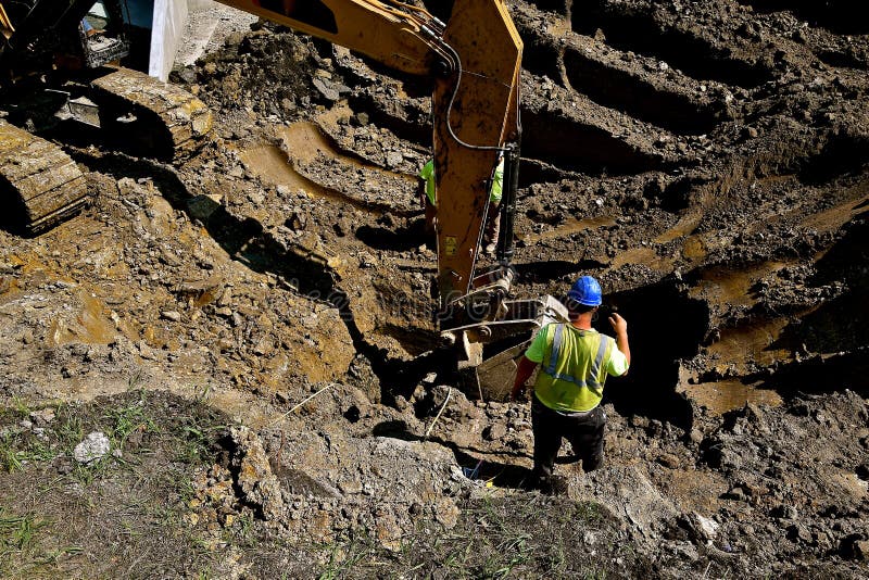 Downward Look at Excavating Machine Digging a Hole Stock Image - Image ...