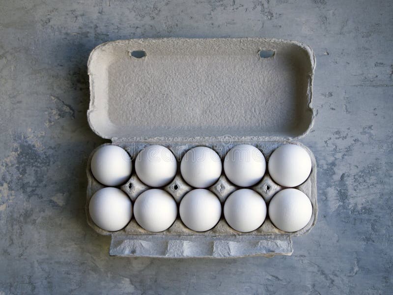 A dozen eggs in a box. stock photo. Image of container - 207152652