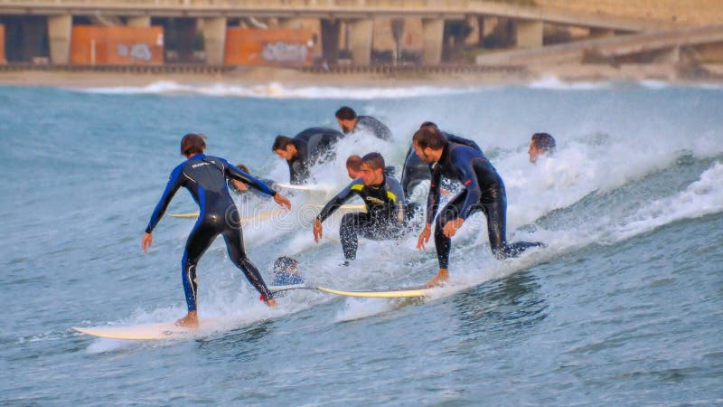 Dozen Surfers Trying To Ride a Wave Editorial Photography - Image of ...
