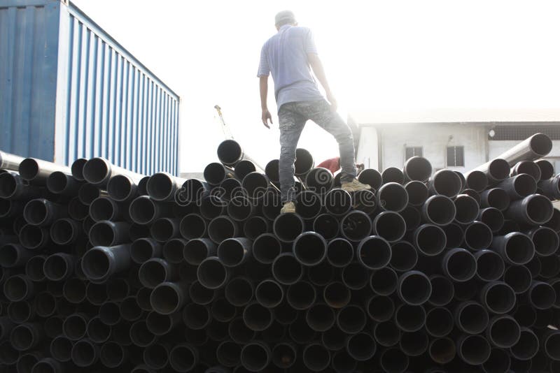 A Pipe Worker at Tanjung Priuk Harbor Editorial Stock Photo - Image of ...