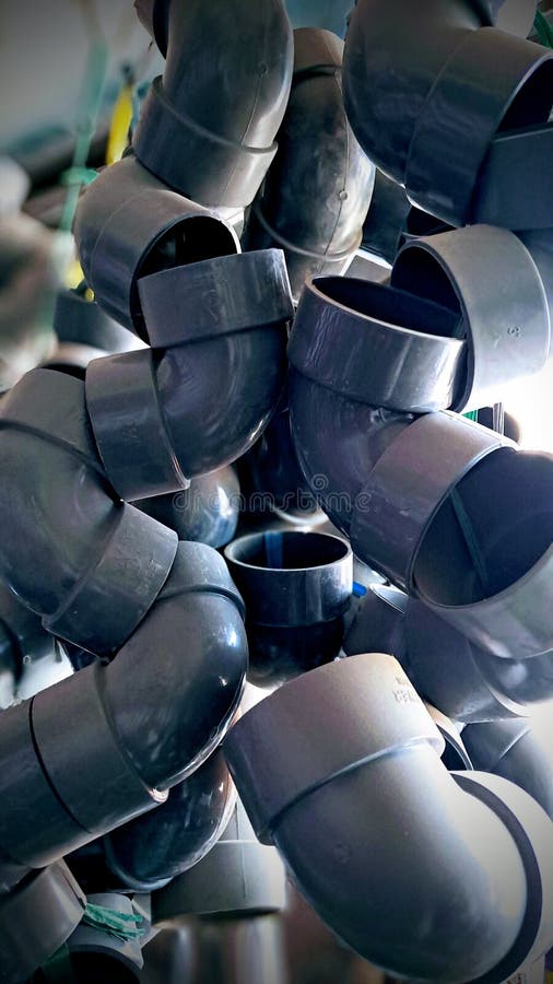 Dozens of Pipe Elbow Joints Hanging Randomly. Stock Image - Image of ...