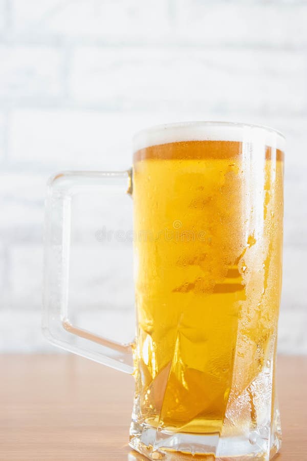 Draft Beer in Beer Glasses Placed on a Wooden Table Stock Photo - Image ...