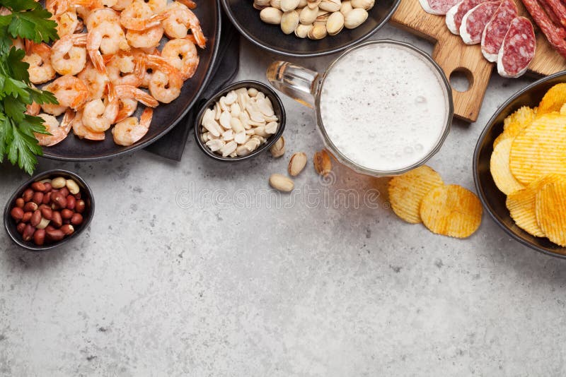 Draft beer and snacks stock image. Image of glass, meal - 161902149