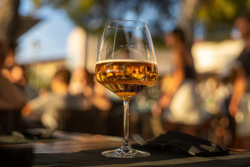 Draft Beer in Wine Glass on Restaurant Table Stock Photo - Image of ...