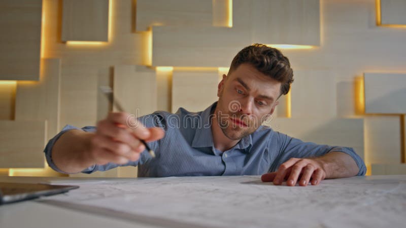 Draftsman Working Building Plan in Architectural Firm Closeup. Serious ...