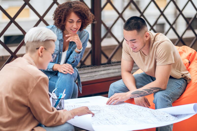 Draftspeople Involved in Analyzing a Technical Drawing Stock Photo ...